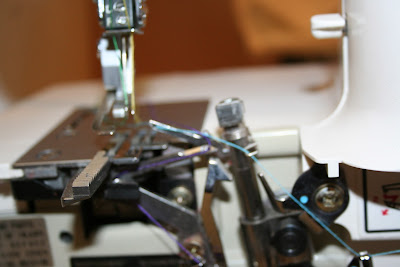 Tammy's Craft Emporium: White Superlock 2000 serger and dog bed.