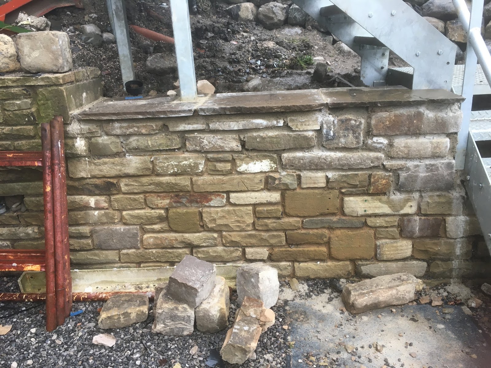 Settle Station Water Tower: Stone Wall and Aluminium Cladding
