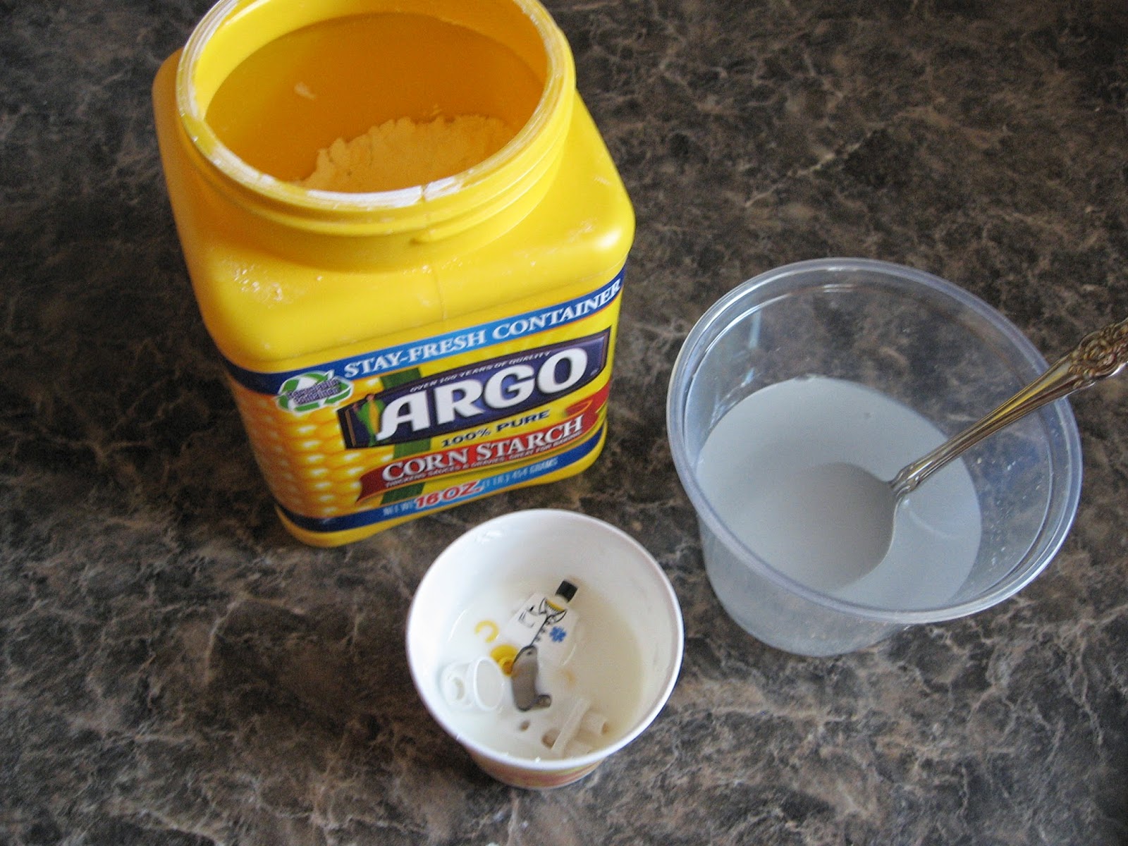 Almost Unschoolers: Lego Movie Surprise, Corn Starch Oobleck Lego Dig