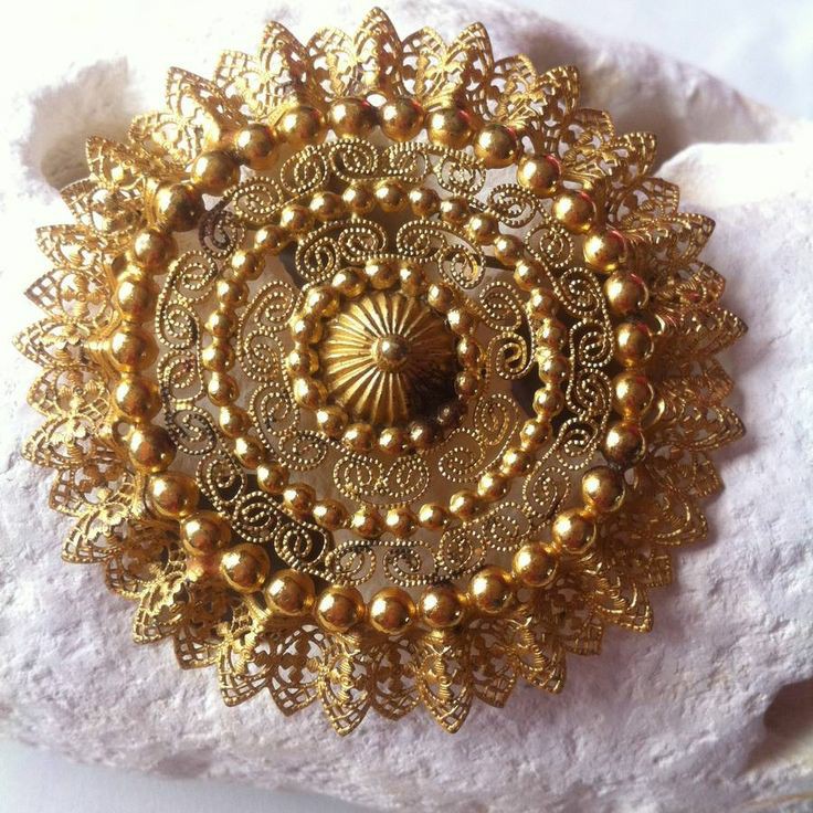 Golden brooch designs