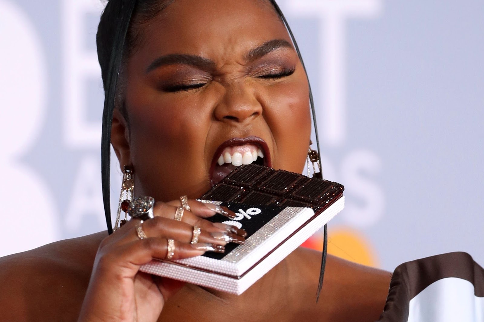 Lizzo goes quirky in Hershey's chocolate bar dress at the 2020 BRIT Awards