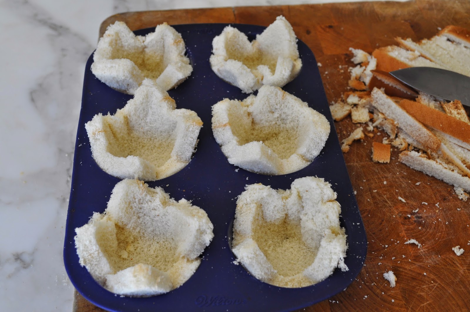 Cooking with Manuela: Baked Cheesy Bread Cups filled with Eggs and Pancetta