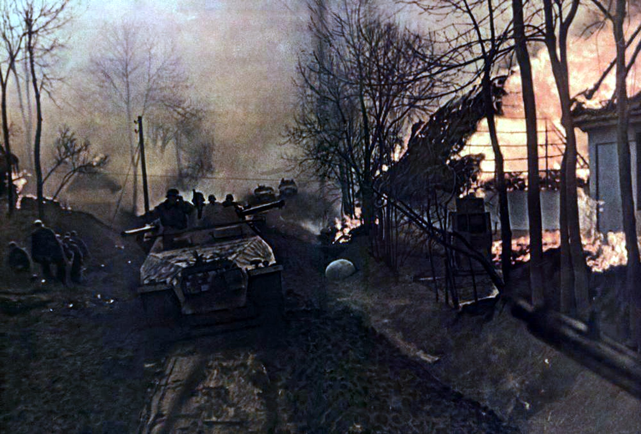 World War II in Color: Panzergrenadiers Driving through Burning Village