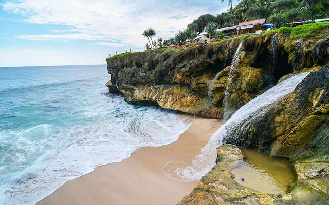 The Beauty of the Hidden Banyu Tibo Beach in Pacitan, East Java