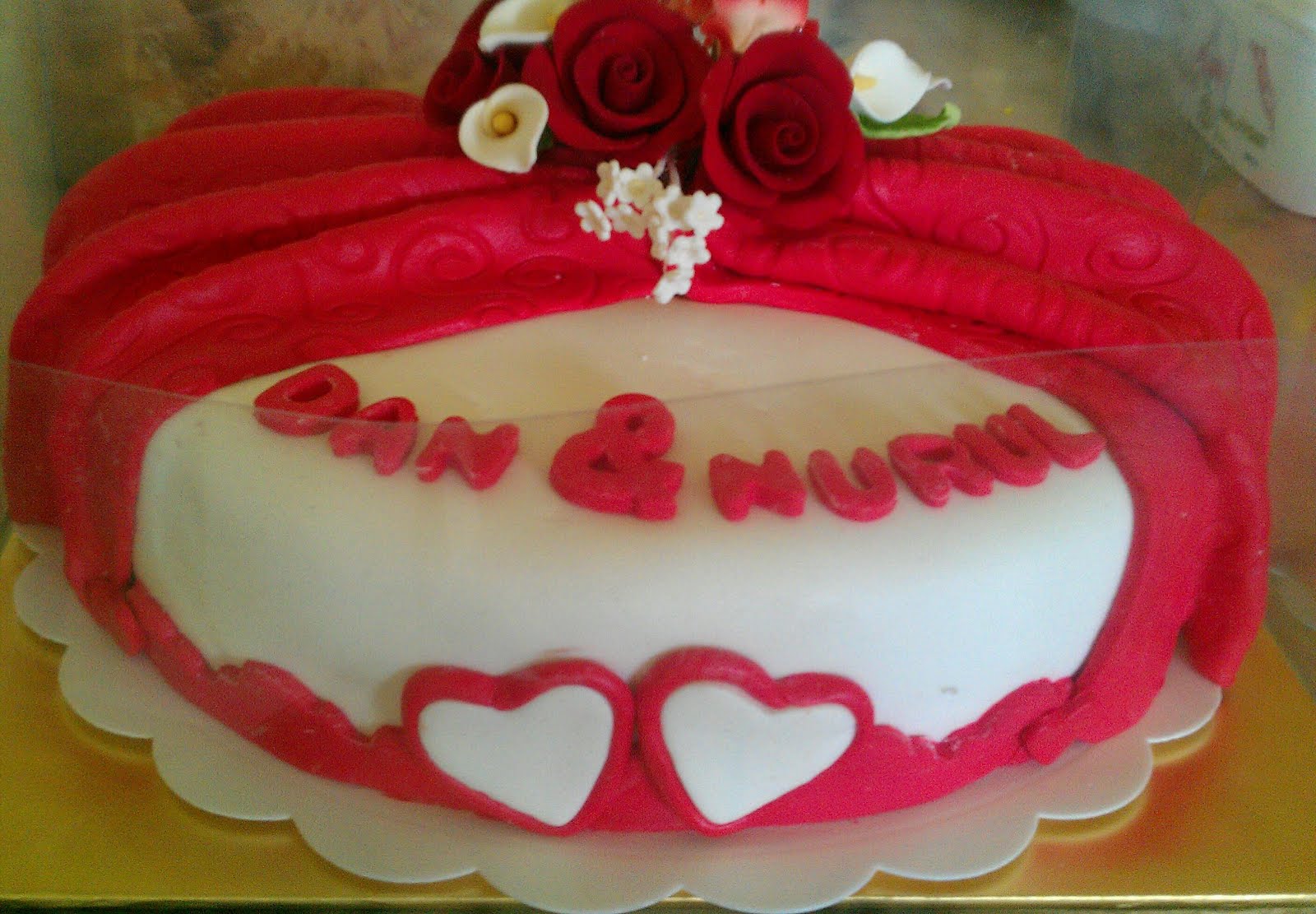 Red and white fondant cake