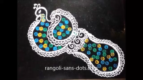 Free hand peacock drawing in rangoli