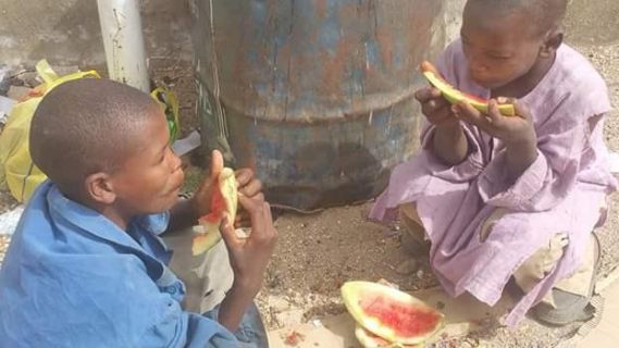 Heartbreaking Photos Of Two Children Eating From A Garbage Drum In Kano ...