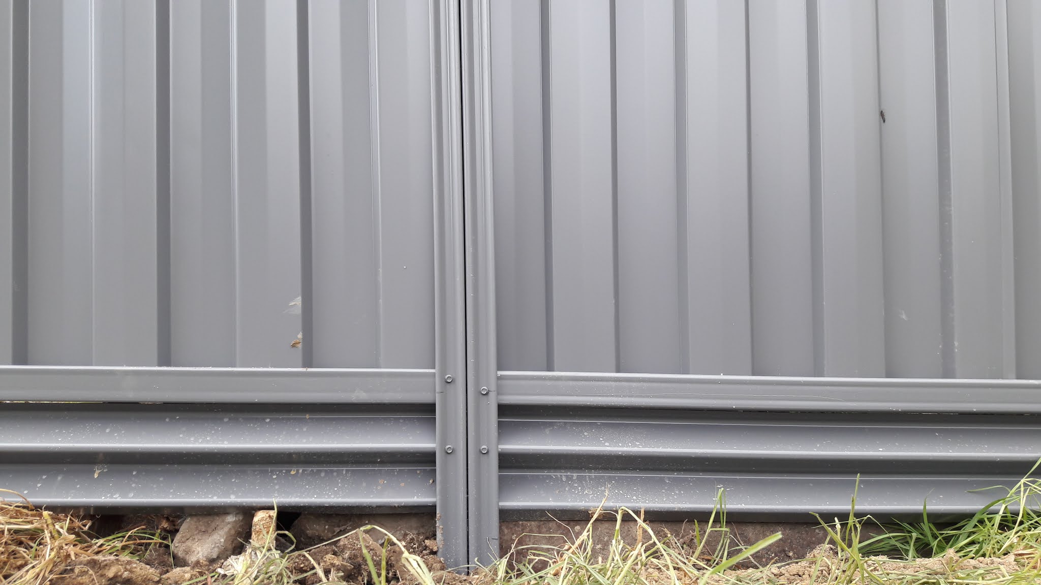 Ironman Fencing: Metroll Metline Colorbond fence with steel Gram plinth