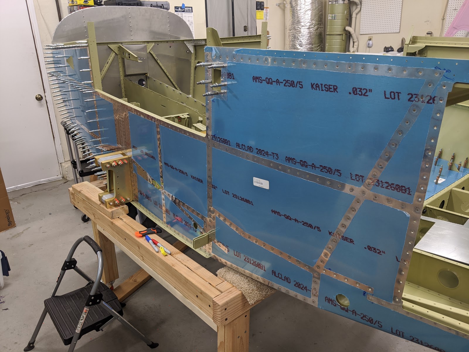 Damazio family's RV-10 project: Fuselage side skin riveting continued