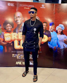Images of Rotimi Salami standing tall
