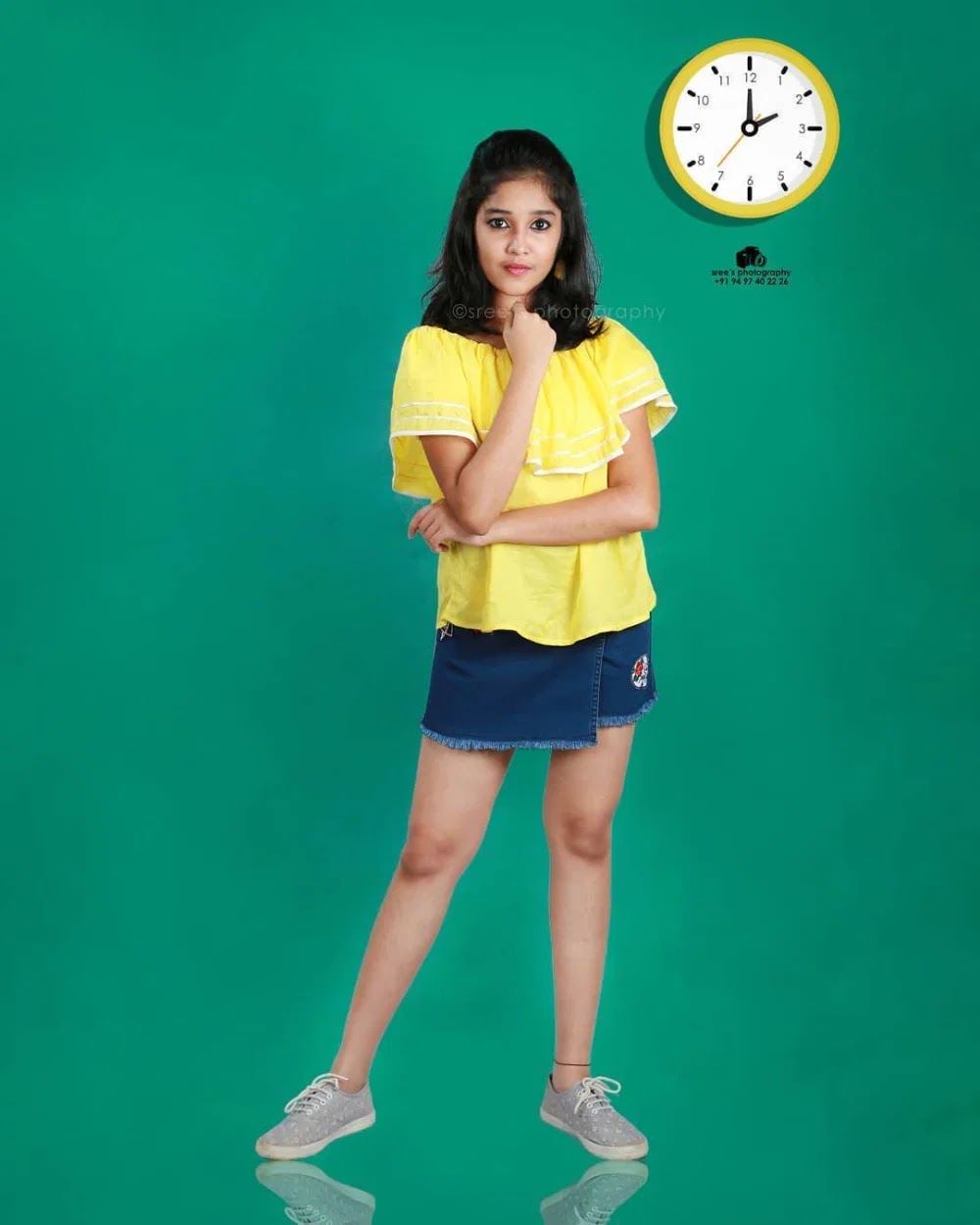 Anikha Surendran cute stills in mini skirt