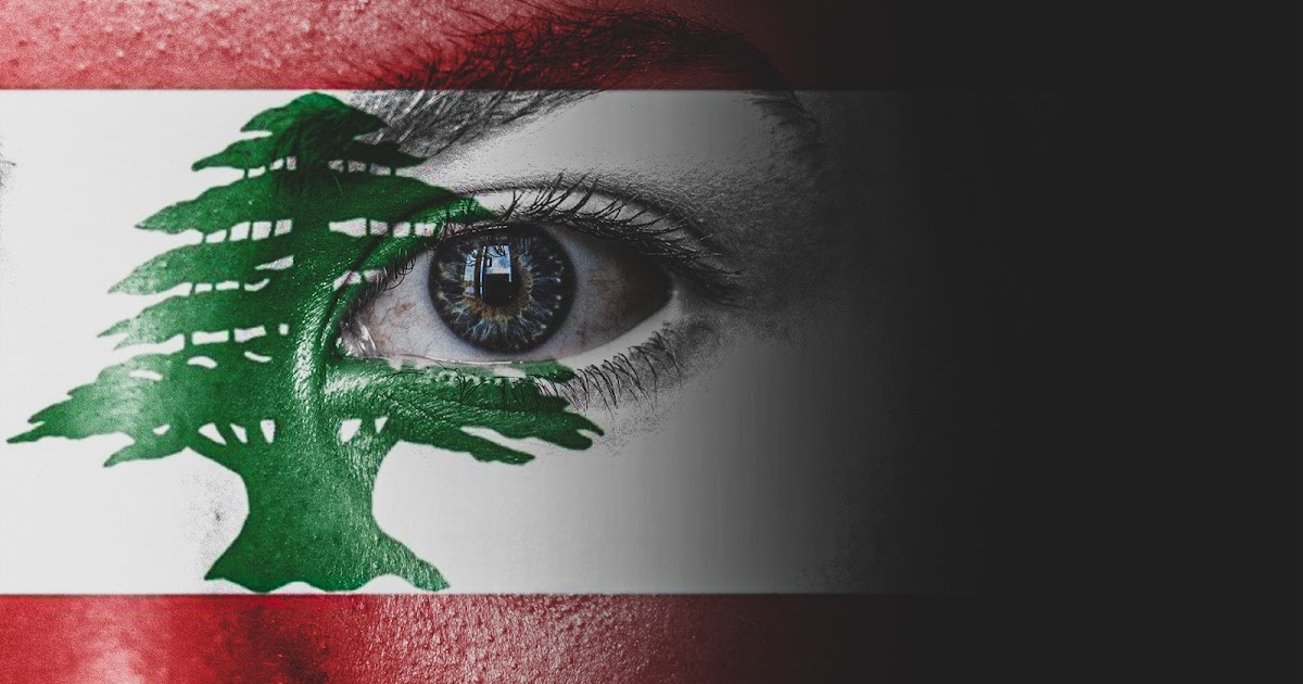 Photo of the flag of Lebanon on the face of a Child background
