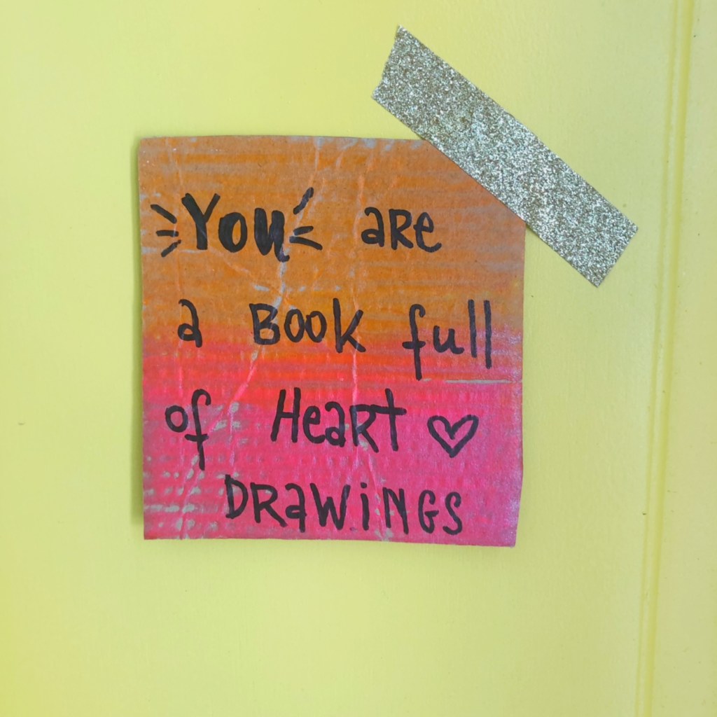 Kindness messages created with recycled cardboard boxes