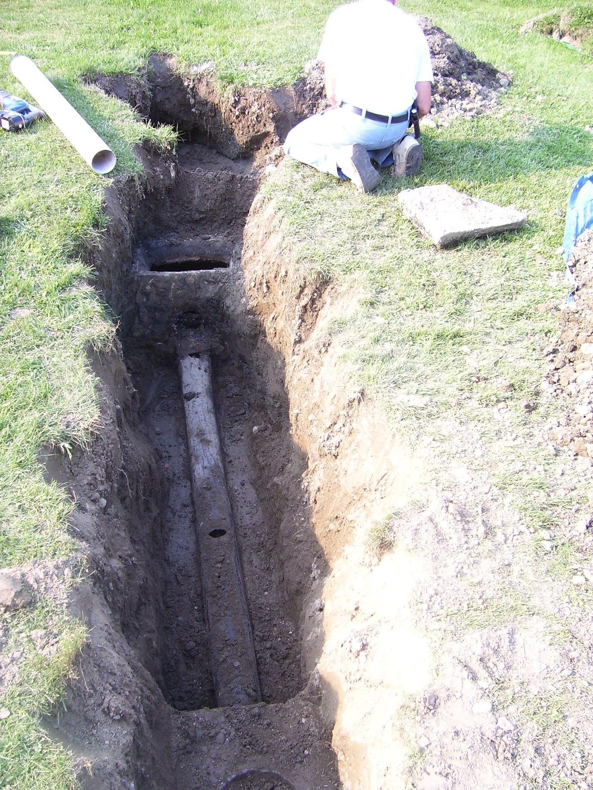 * Digging up my septic tank by hand for my 62nd birthday, 2006