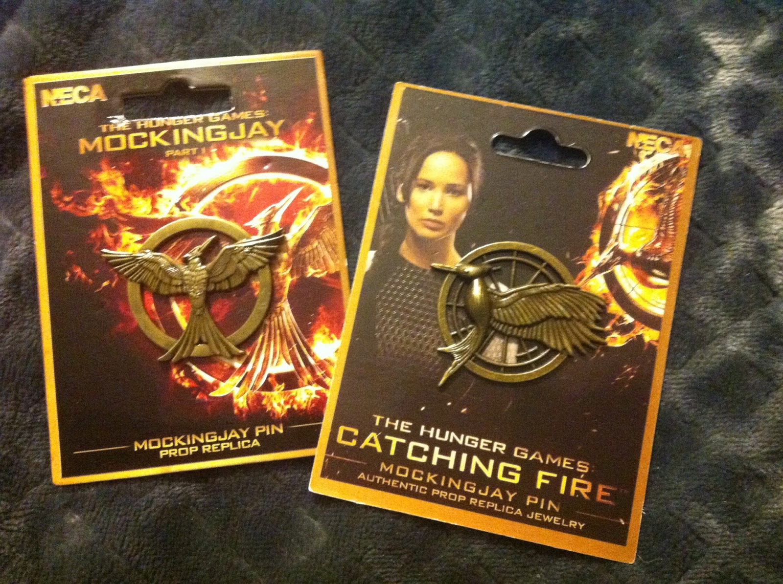 Mockingjay Pin On Fire