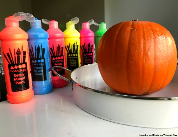 Learning and Exploring Through Play: Carve Free Neon Painted Pumpkins
