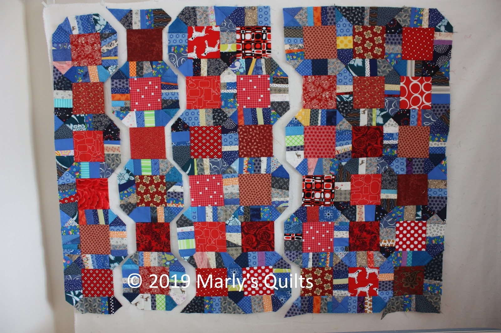 AHIQ: Improvisational Utility Quilts: Overlapping Octagons with red centres