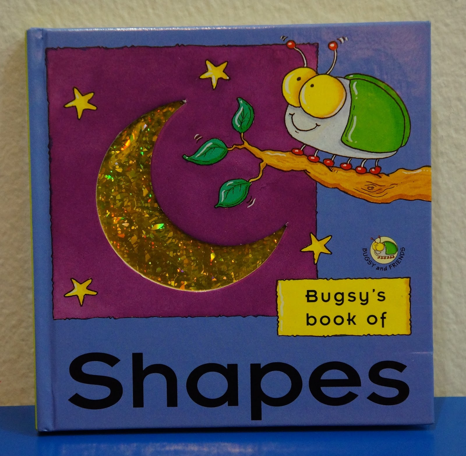 Book: Bugsy's book of Shapes (Board Book) | NINOS SHOP