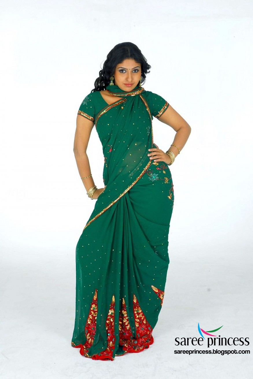 Silandhi star Monica poses in various style in green photo shoot
