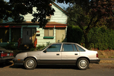 OLD PARKED CARS.: The American Dream: 2X 1986 Dodge Lancer ES Turbo.