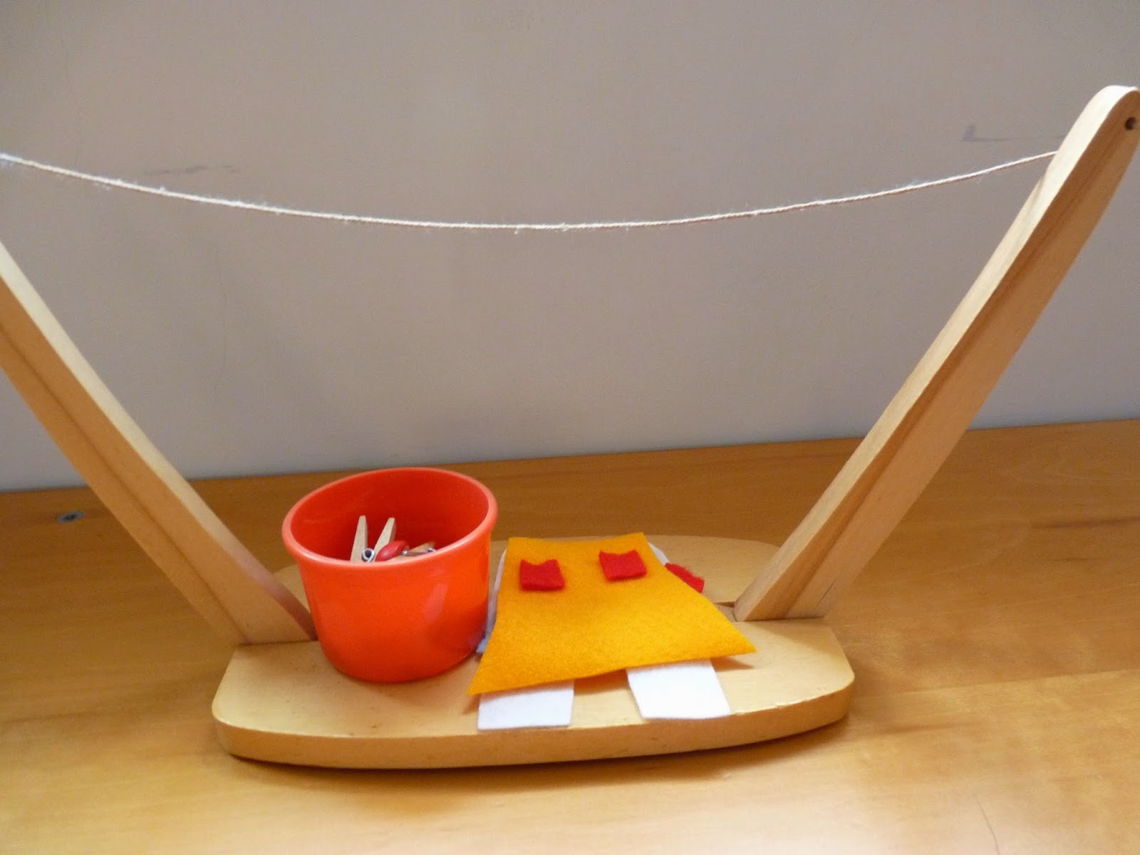 Practical Life IX - Using clothespins (clothes-pegs)