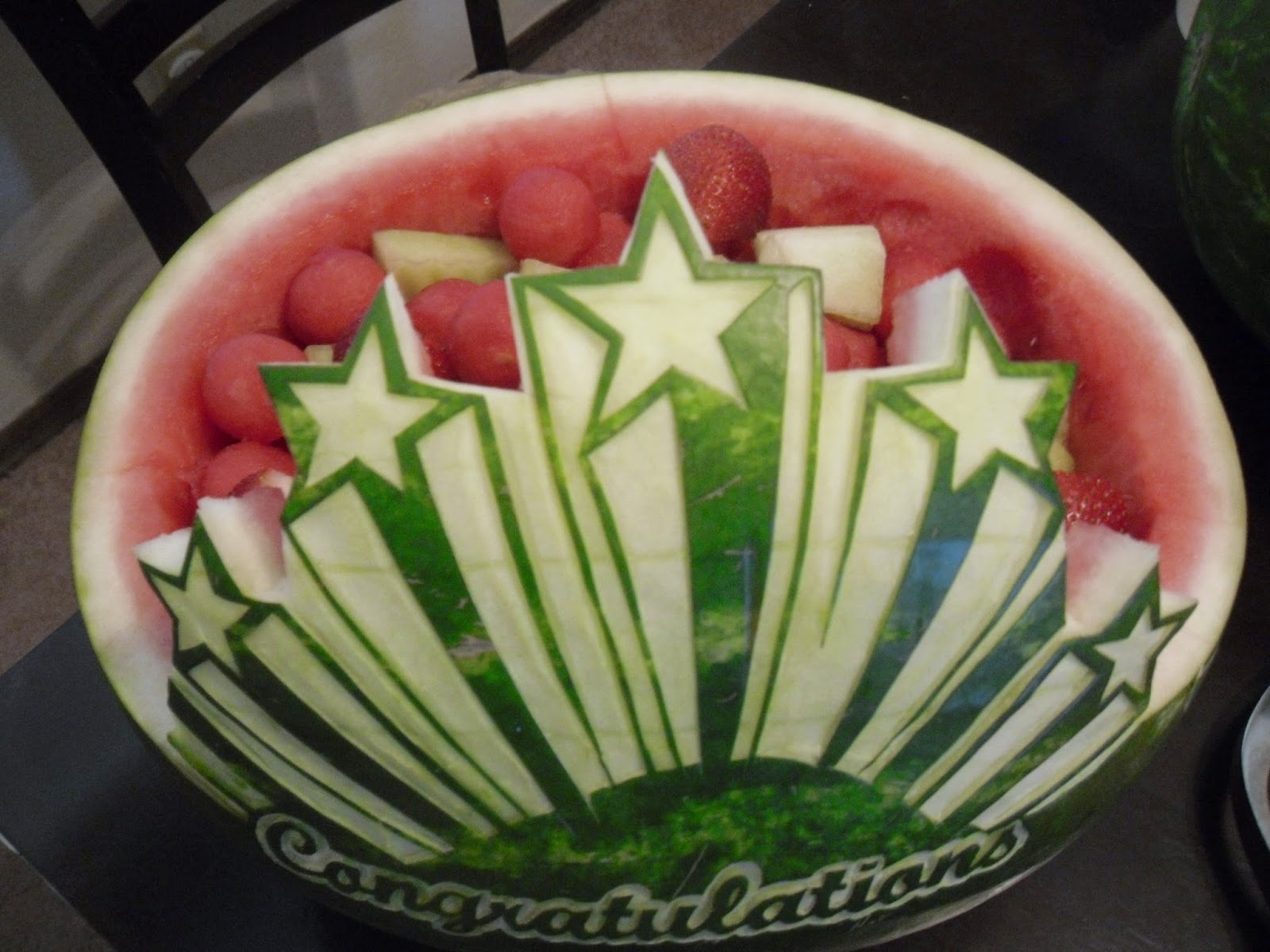 Fruit Art Arrangements: Watermelon fruit bowl for graduation.