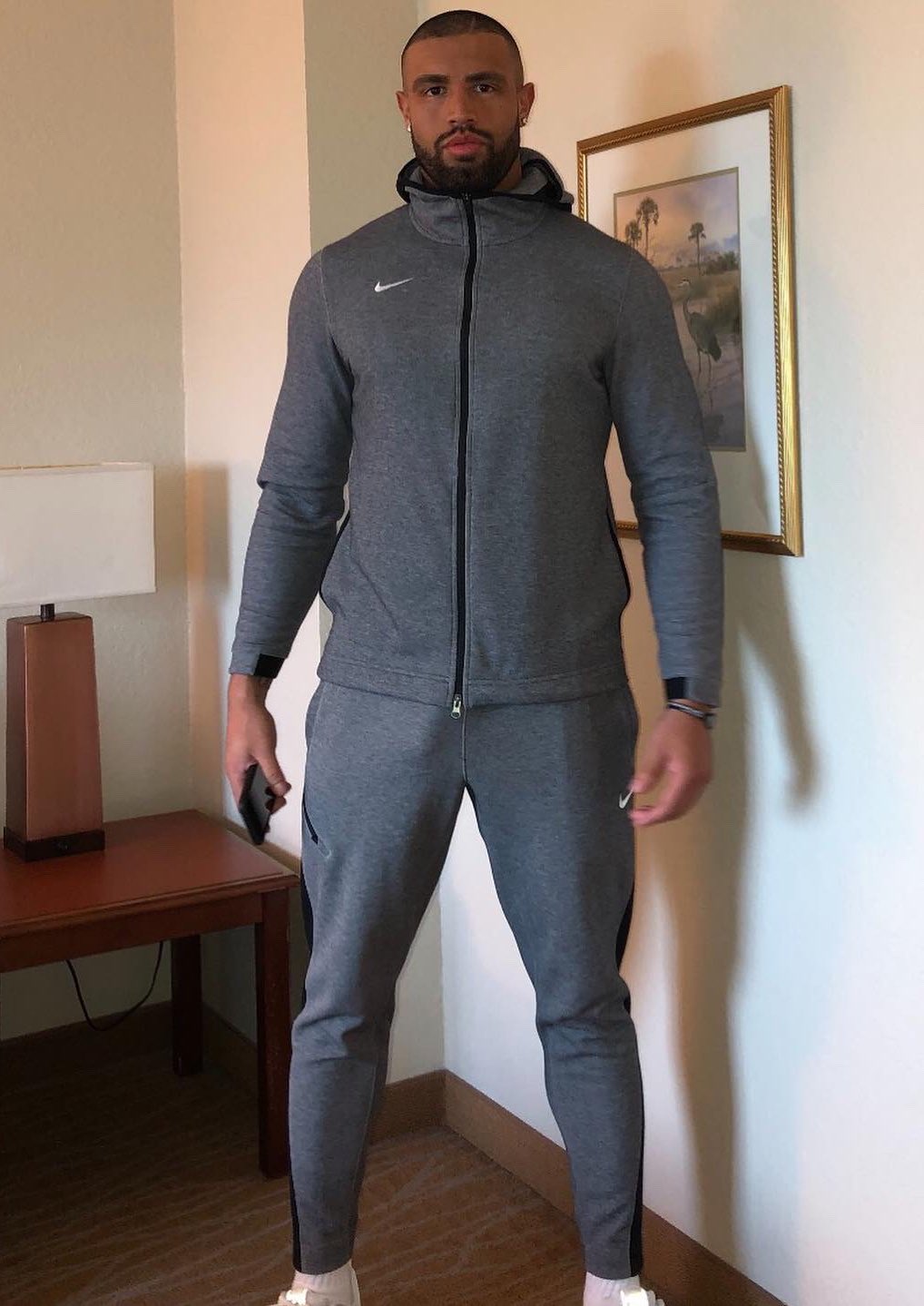 Pictures of Kevin Portillo standing tall at 6′ 5″ feet