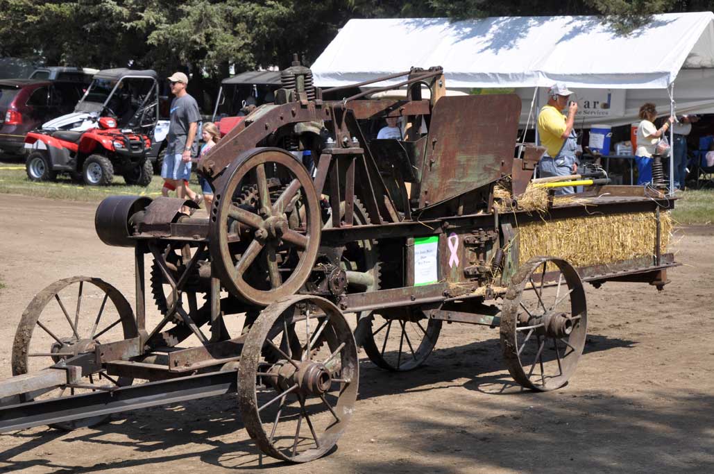 Taken For Granted: Woman's Tractor and Dain Hay Press