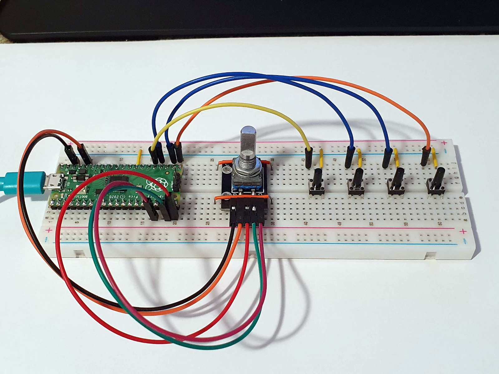 Volume and media control buttons with Raspberry Pi Pico · One Transistor