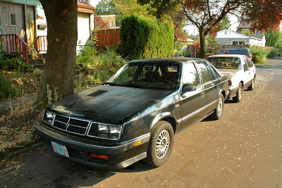 OLD PARKED CARS.: The American Dream: 2X 1986 Dodge Lancer ES Turbo.