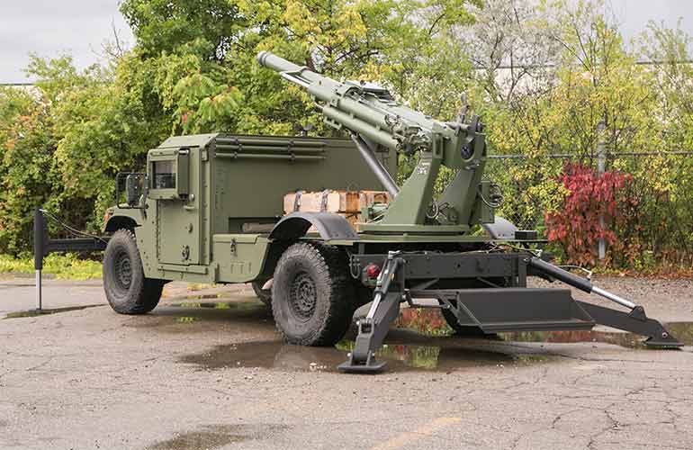 DEFENSE STUDIES: AM General Unveils 105 mm Howitzer Mounted on 4x4 Vehicle