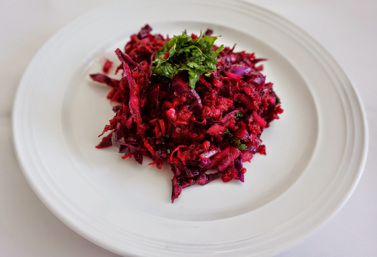 Raw beetroot, red cabbage and carrot salad
