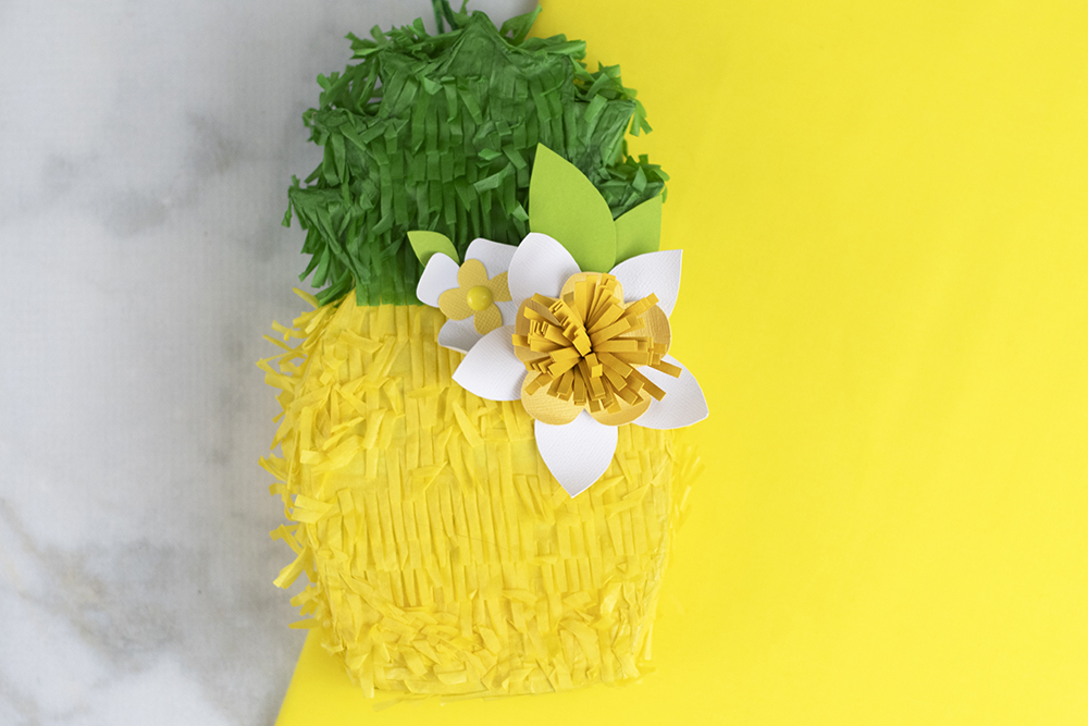 Pinata DIY: Personalizing a Pineapple Pinata with Tropical Flowers ...