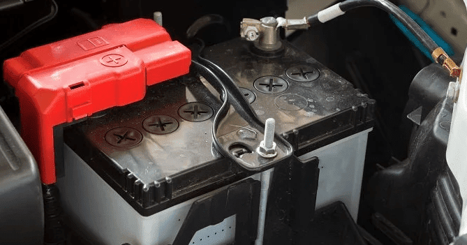Signs of positive and negative on car battery terminals