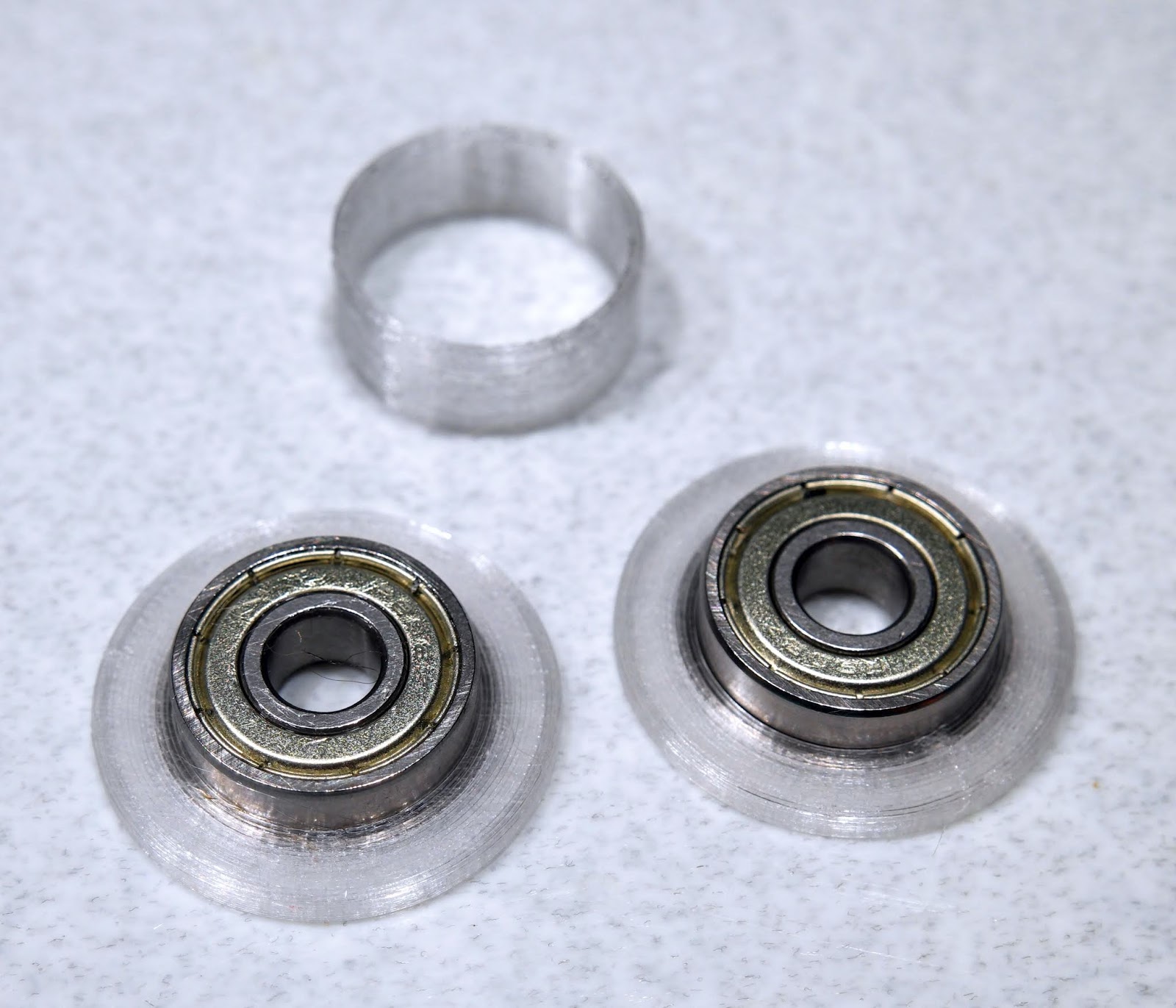 Wide flanged pulleys made from flanged ball bearings