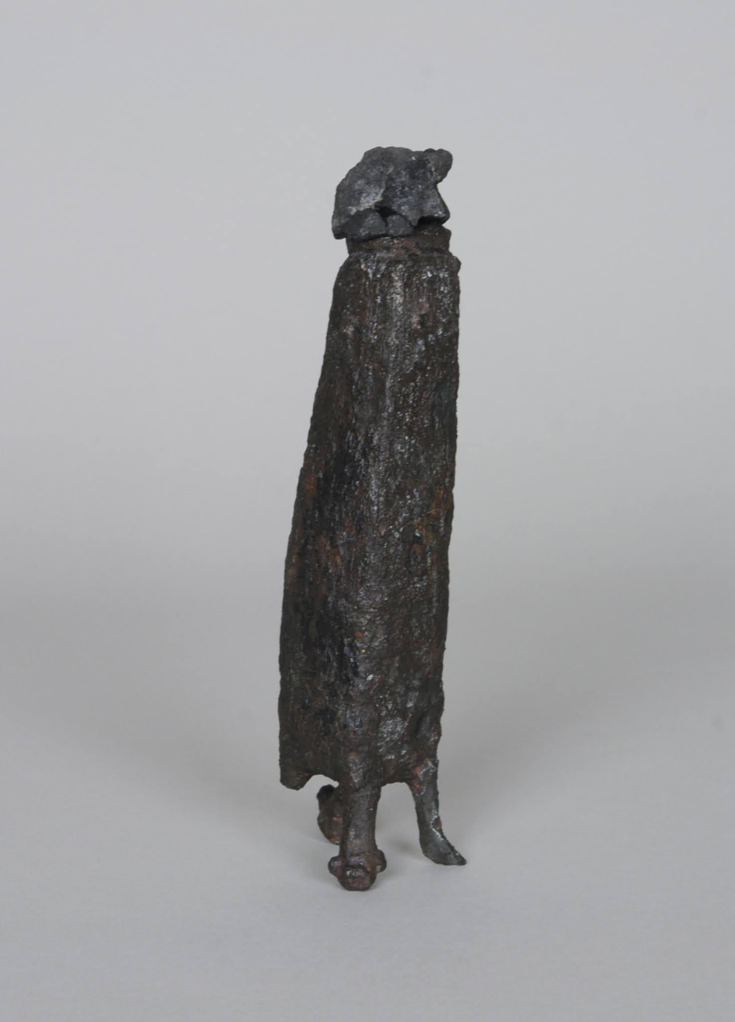 Kohl box in the shape of an elongated figure wearing a helmet (?) and ...