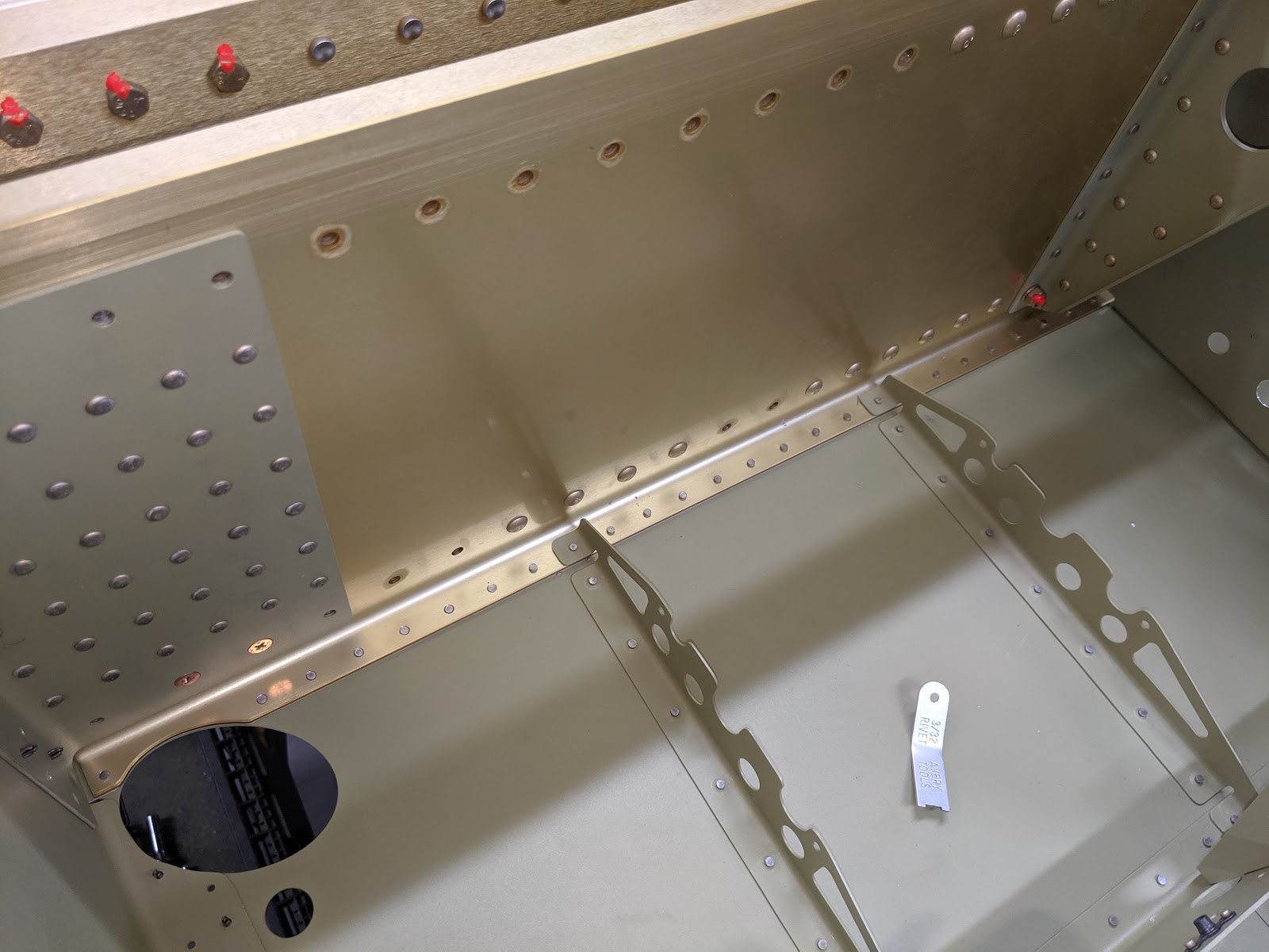 Damazio family's RV-10 project: Forward fuselage bottom skins riveted