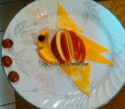 Top Notch Material: Kids snack make fruit and cheese into a fish