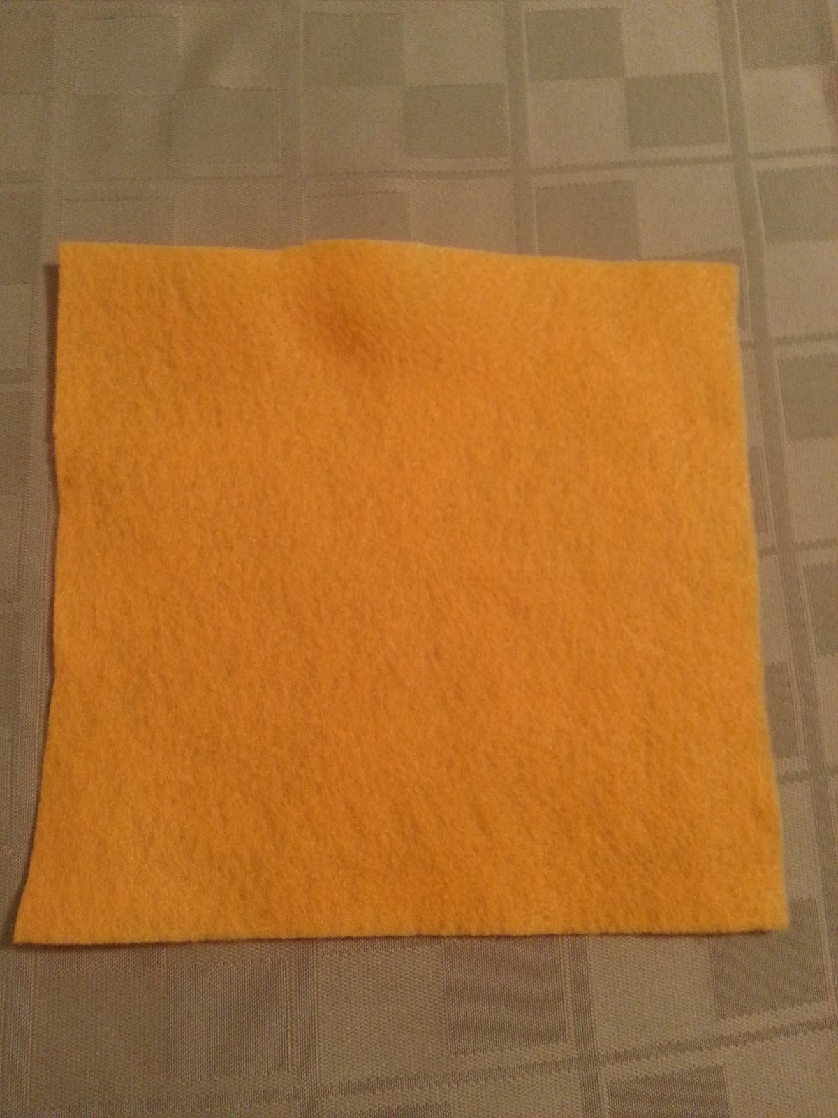 First, start with a square of felt. The larger the square, the larger ...