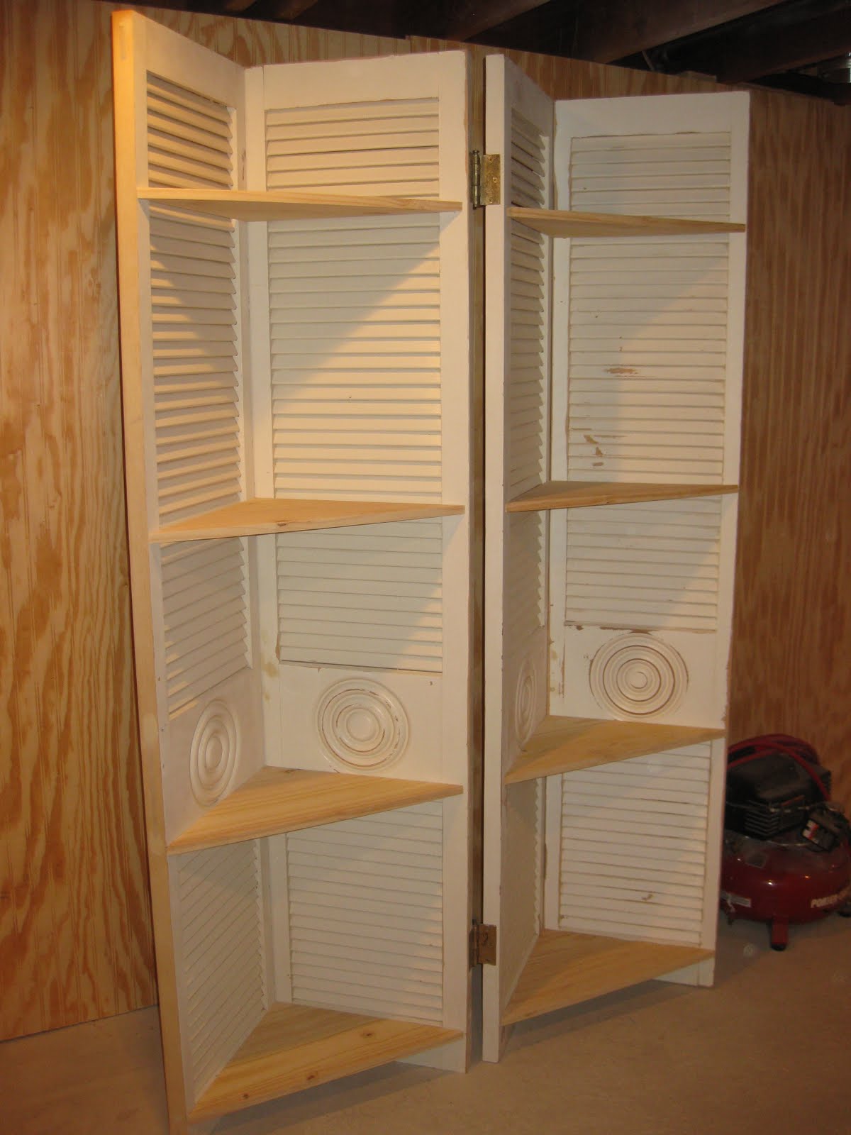 ReKaced Designs: LOUVERED DOORS DISGUISED AS A SCREEN/SHELVING UNIT