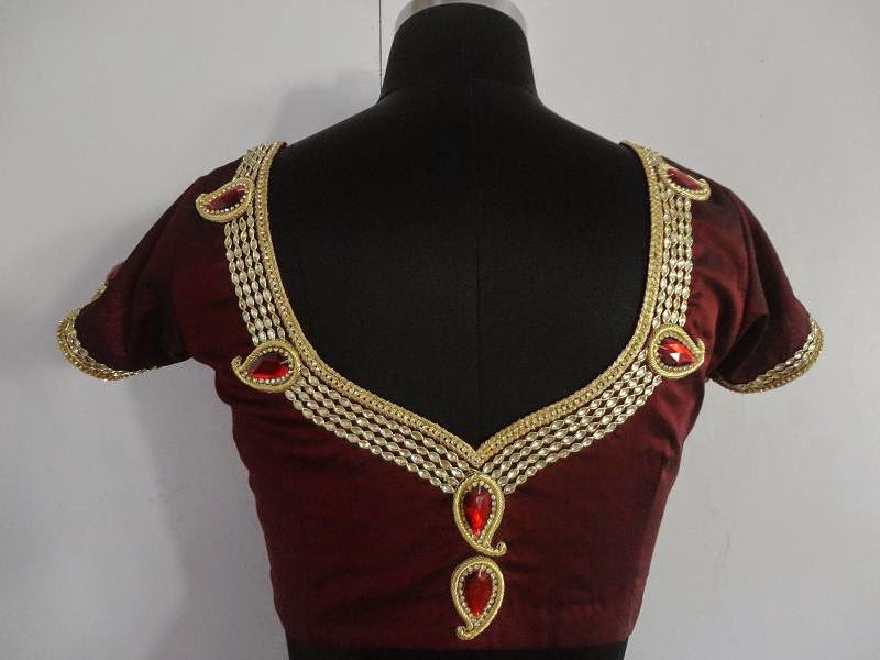 Embroidery and Maggam blouses : Jewellery neck with mango design kundan ...