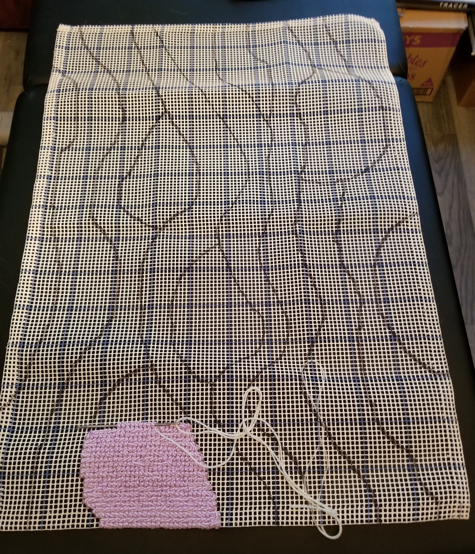 Stamp Queen: Locker hook rug with random patterns.