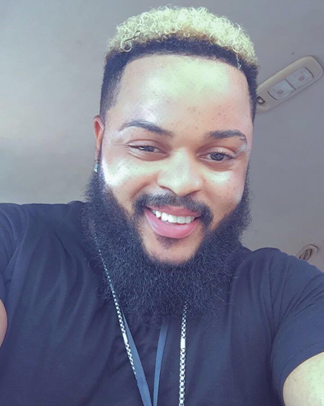 Photos of White Money and his blond stylish hairstyle and beard