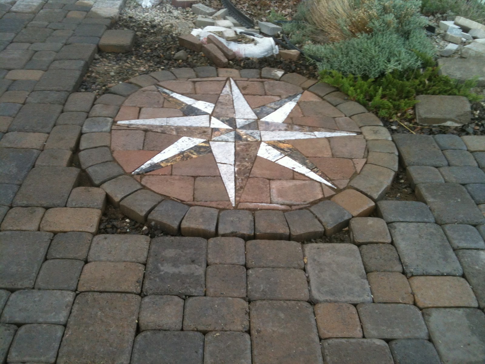 Genius Cafe: Concrete paver project with engraved compass