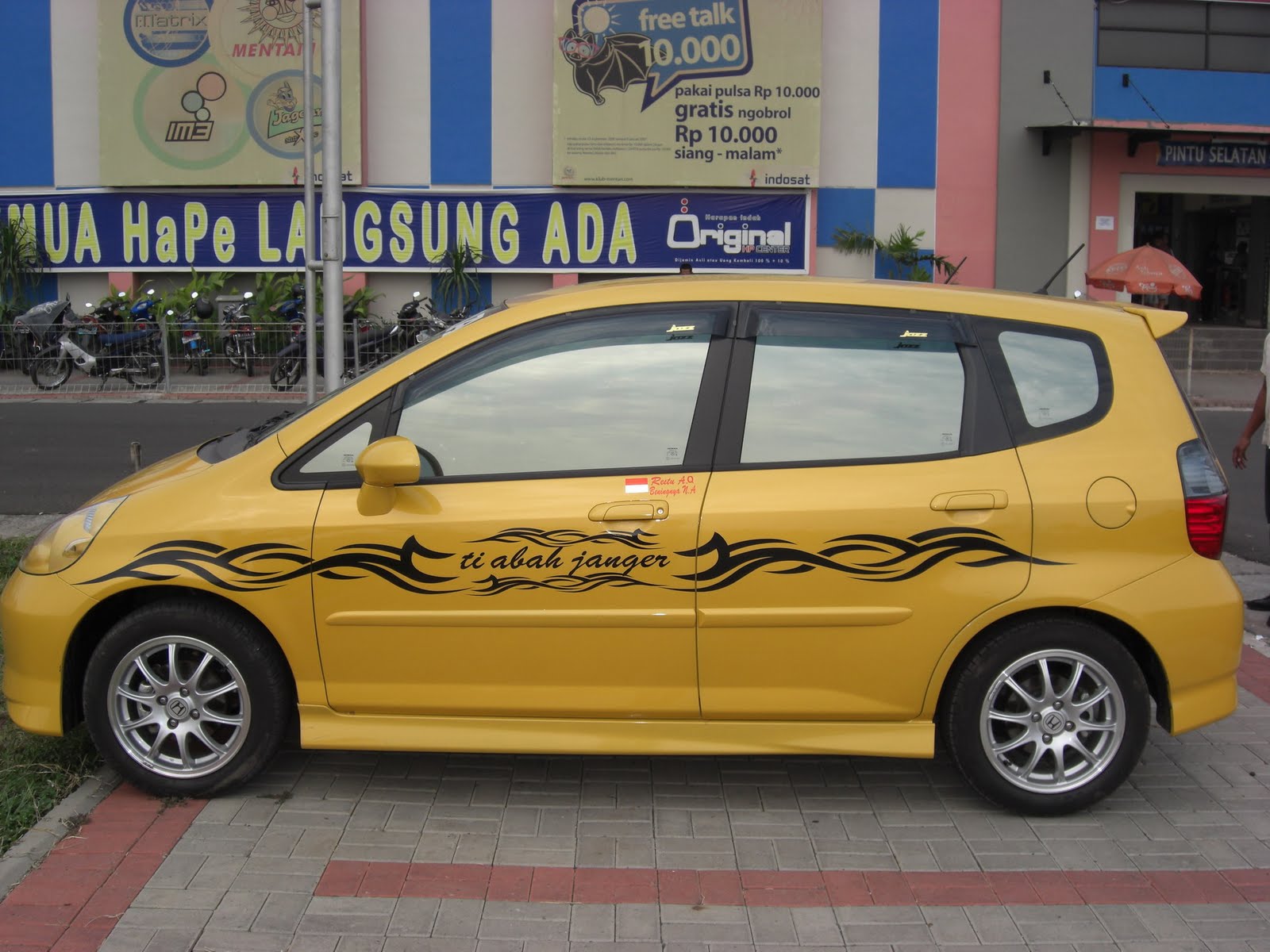 car stiker: New Yellow Honda Jazz With tribal Sticker-Best Car Sticker ...