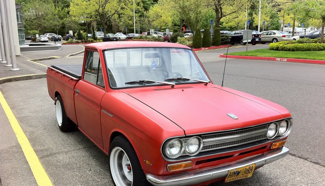 OLD PARKED CARS.: 1969 Datsun 1600 Pickup.