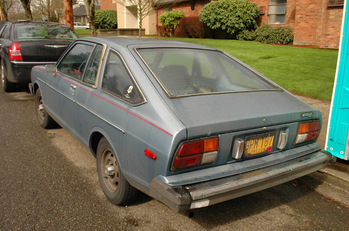 OLD PARKED CARS.: 1981 Datsun 210.