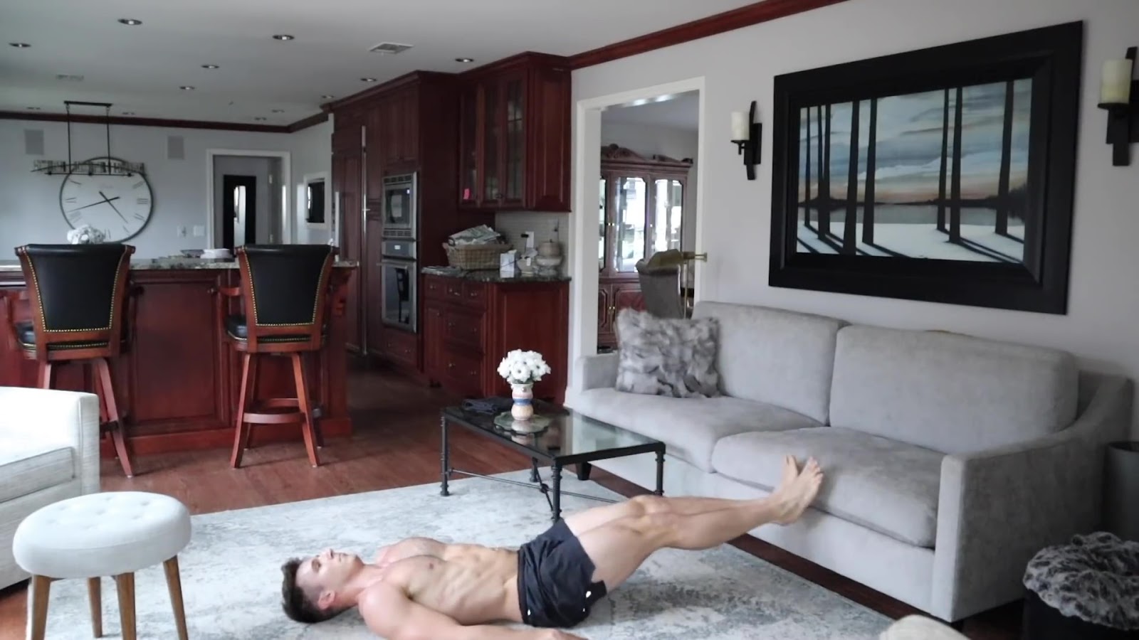Sam Cushing shirtless on his home workout video