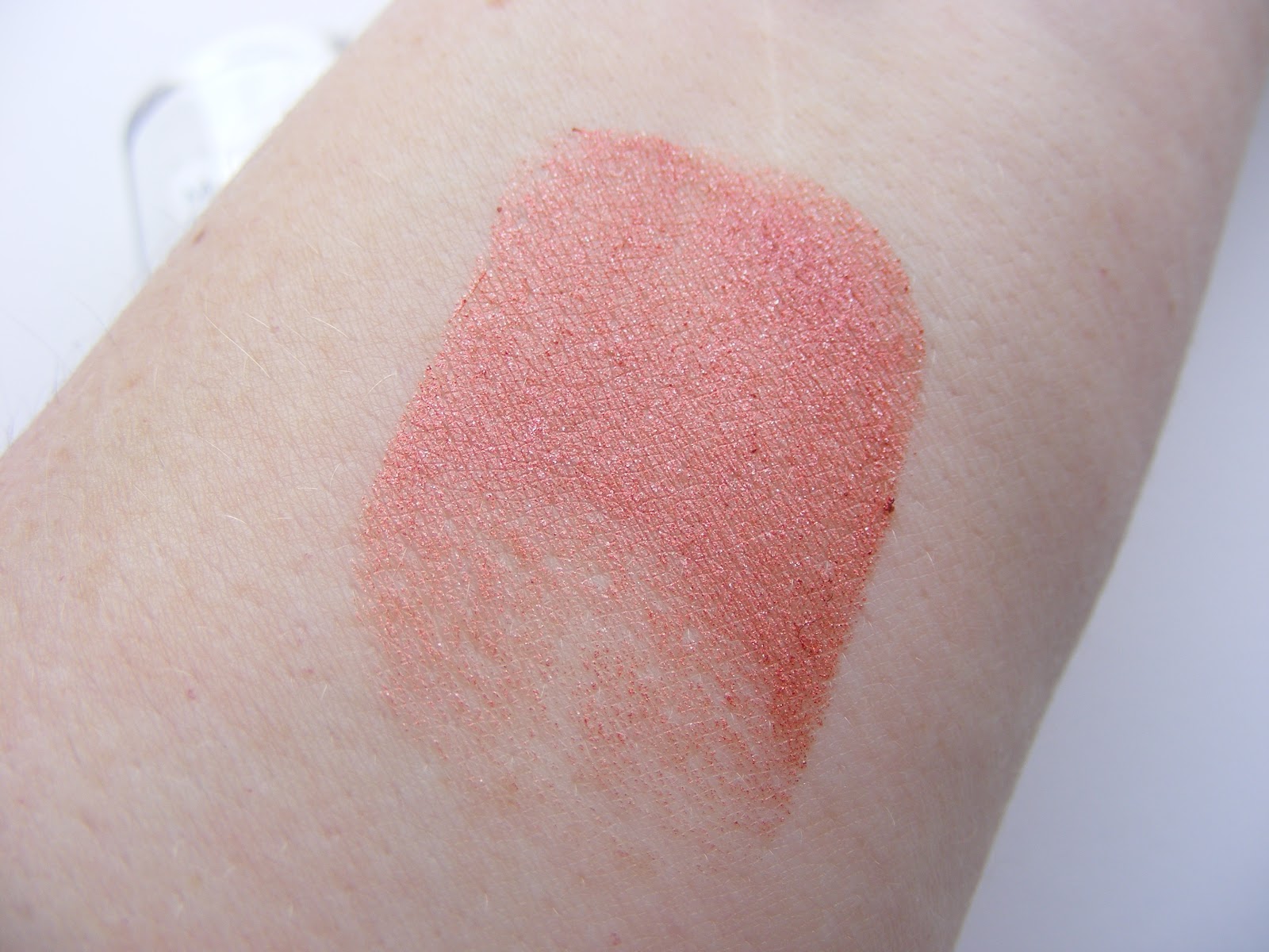 This swatch illustrates how 'Poppy' looks with my skin color...