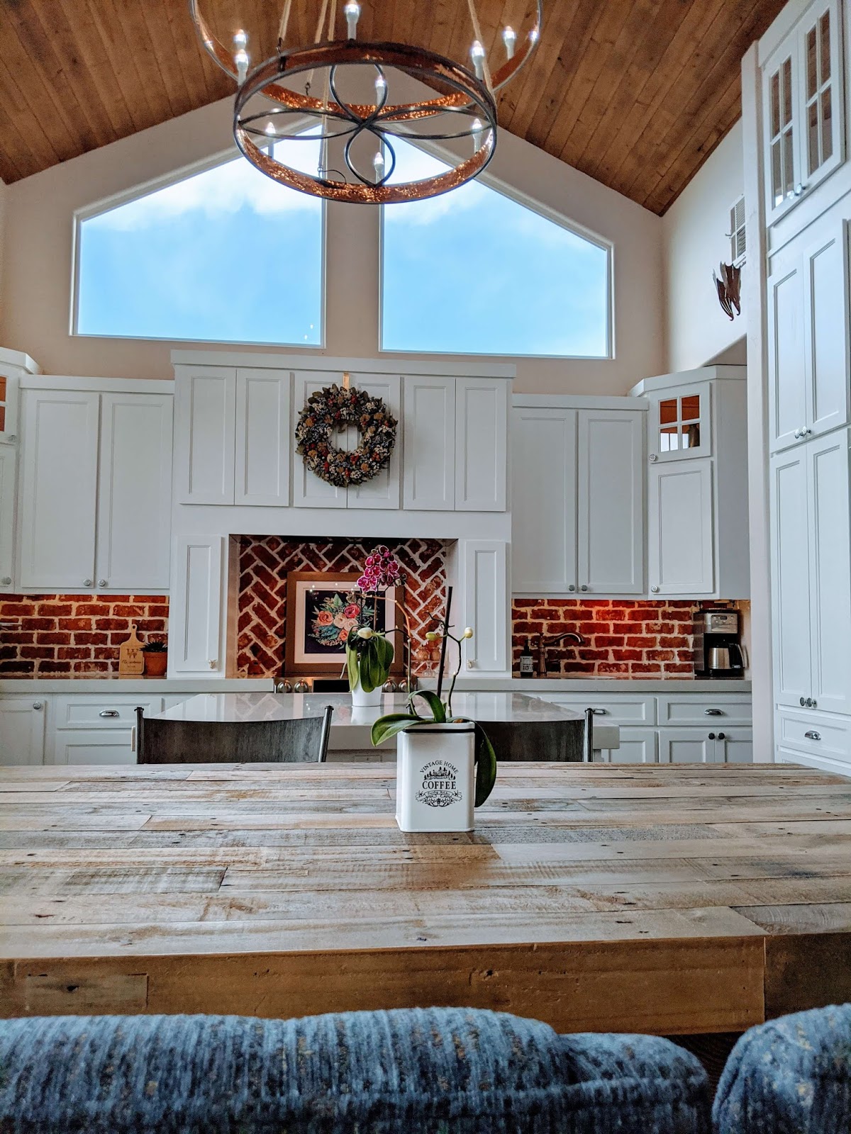 White Kitchen with Brick Backsplash